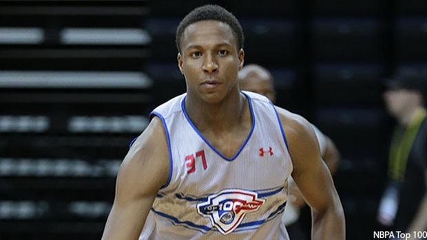 API’s Mark Vital with a putback dunk at the buzzer to beat Paul VI ...